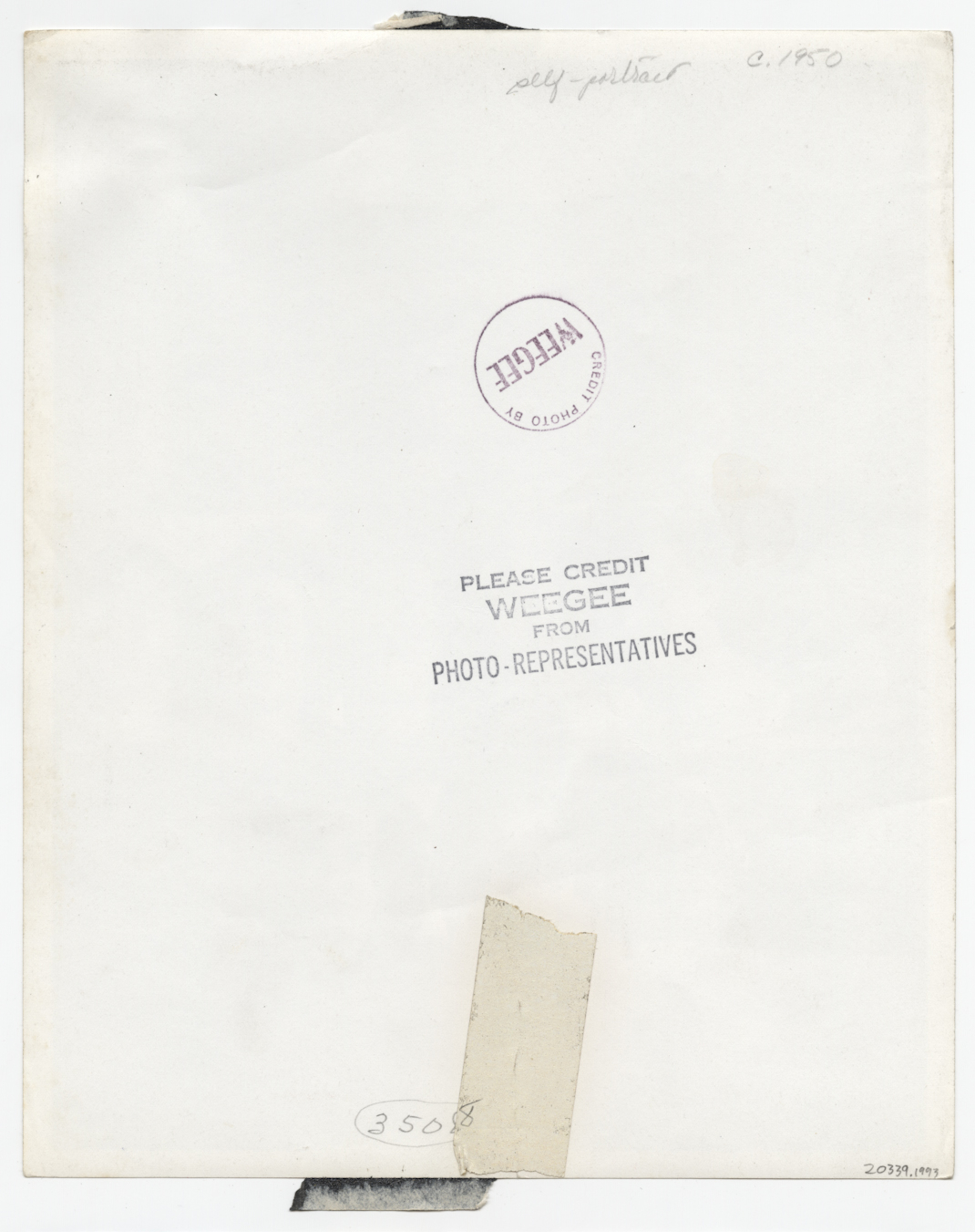 [Weegee among wax heads of celebrities and leaders] | International ...