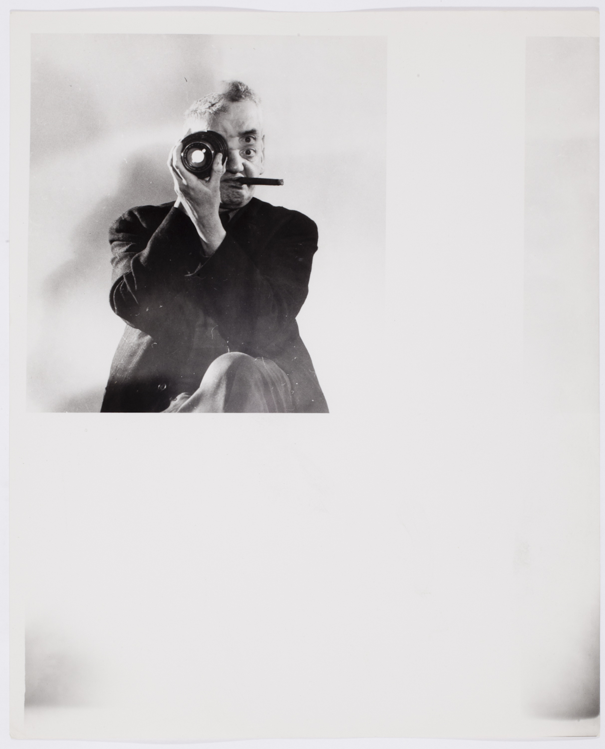 [Weegee self portrait holding a lens and having a cigar in his mouth ...