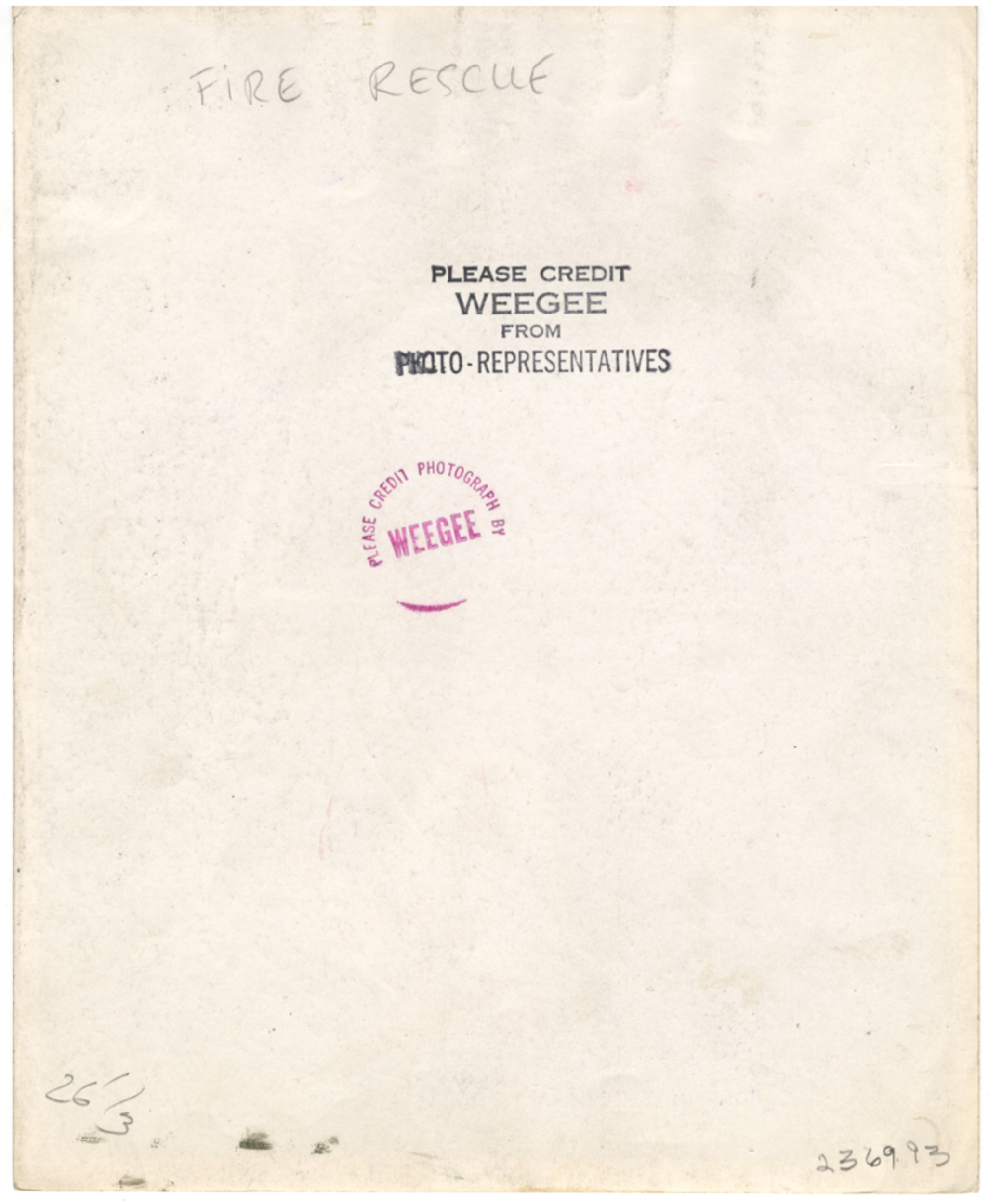 [Police officers carrying a woman] | International Center of Photography