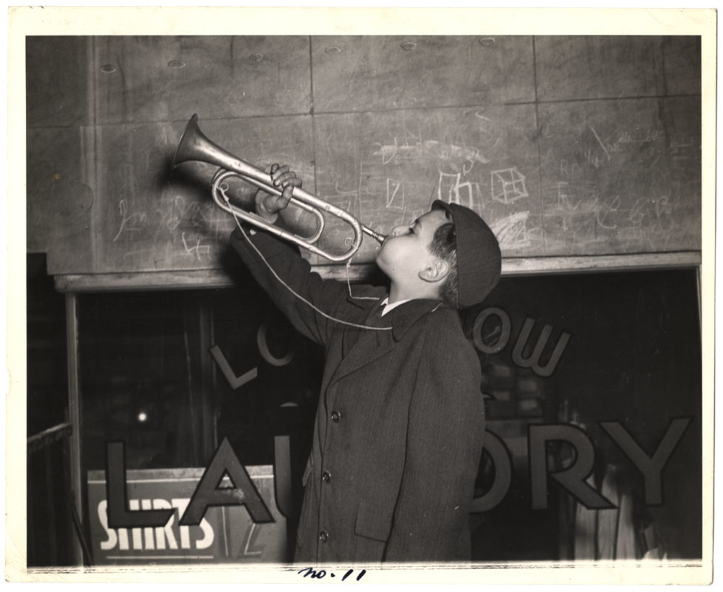 [Bugle playing boy] | International Center of Photography
