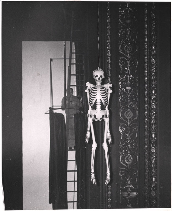 man hanging from ceiling