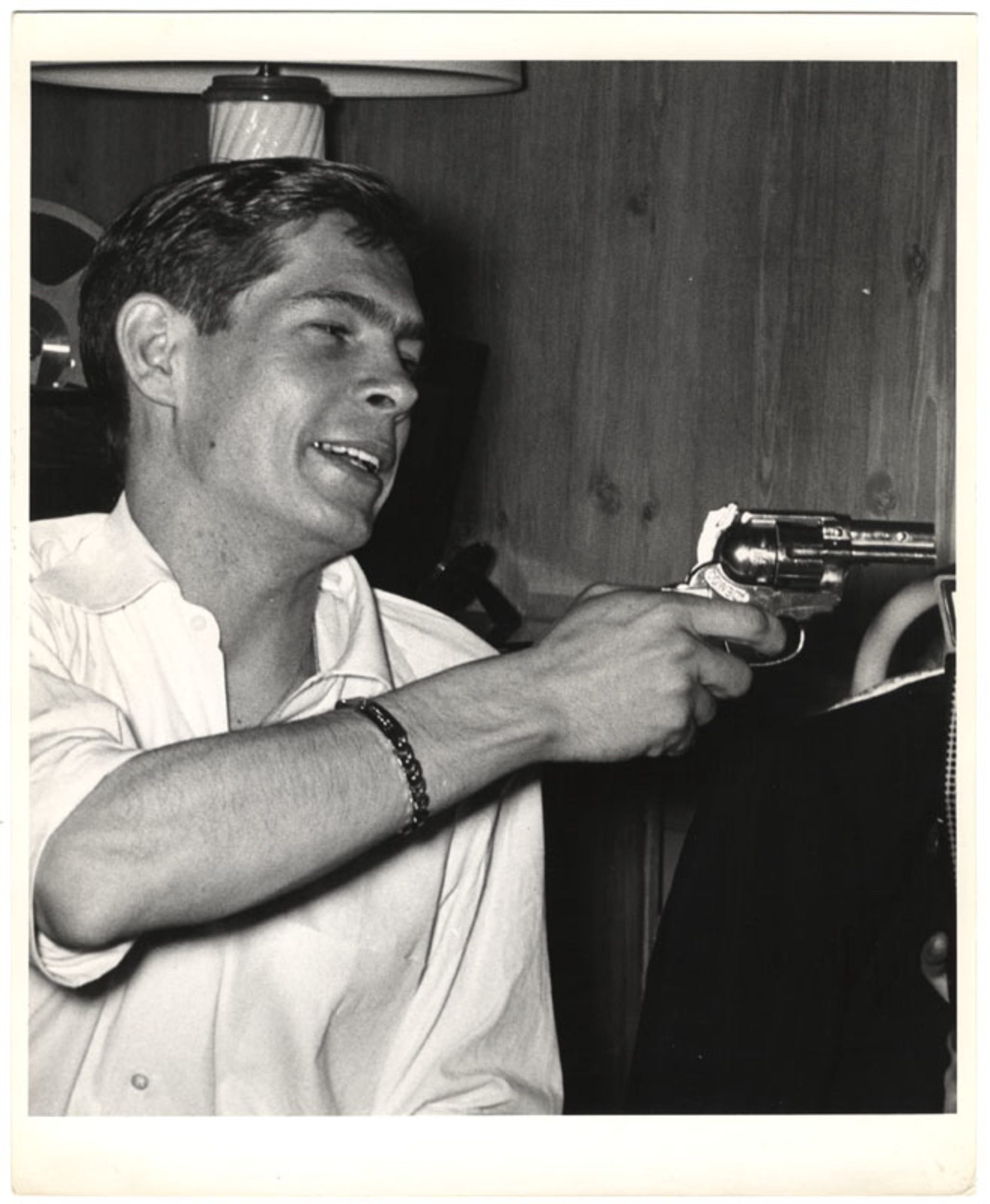 [Johnnie Ray holding gun] | International Center of Photography