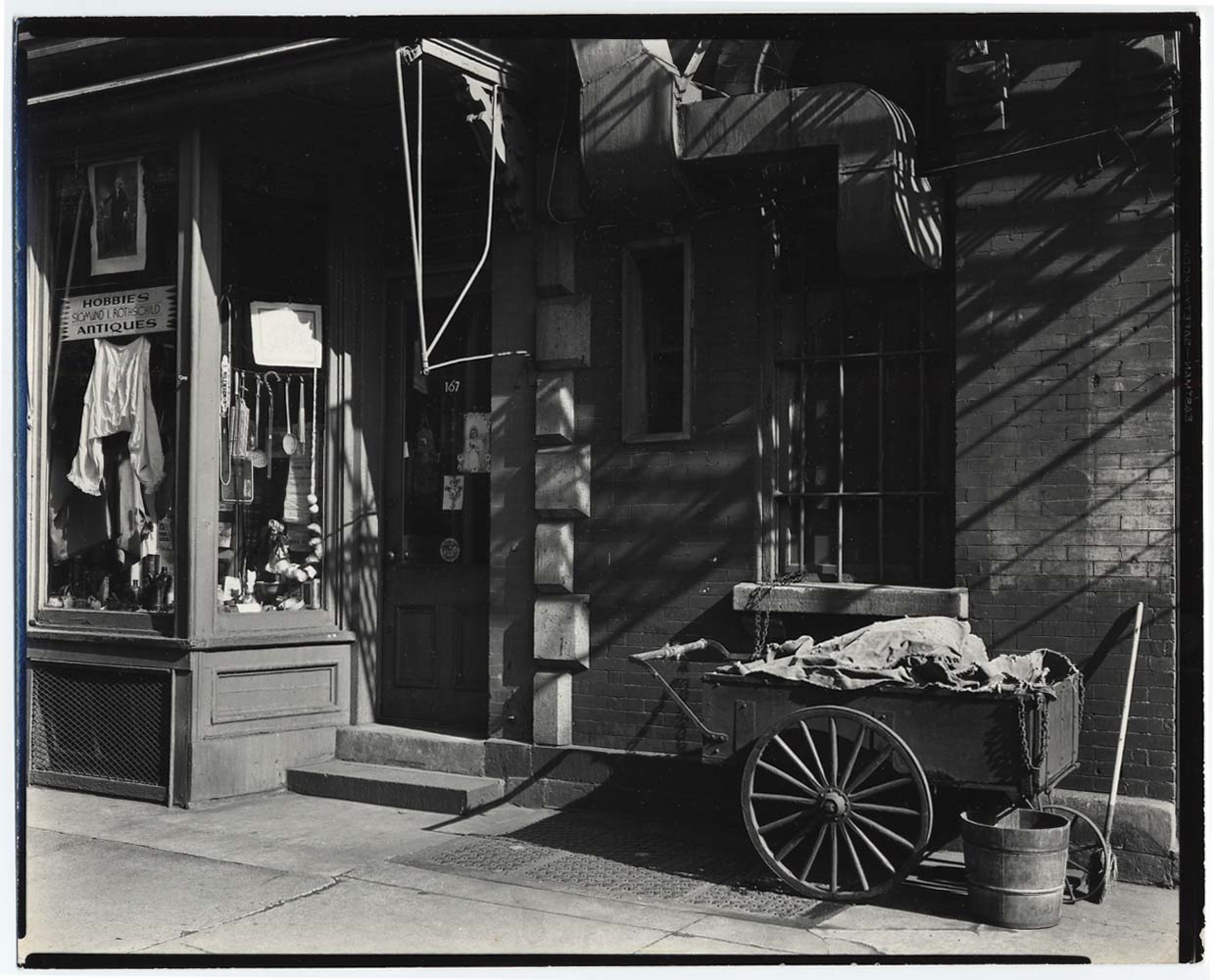 [Sigmund I. Rothchild storefront and pushcart, New York ...