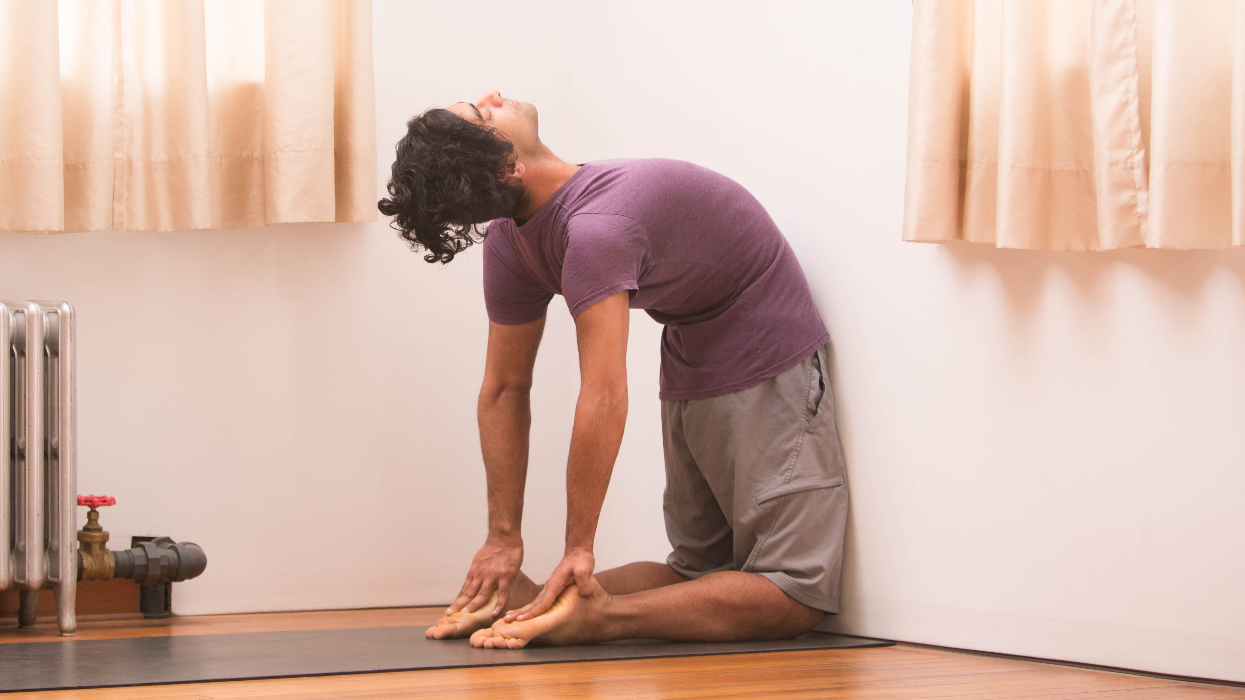 Use a Wall to Get More Out of Standing Backbend, Wheel, and Camel