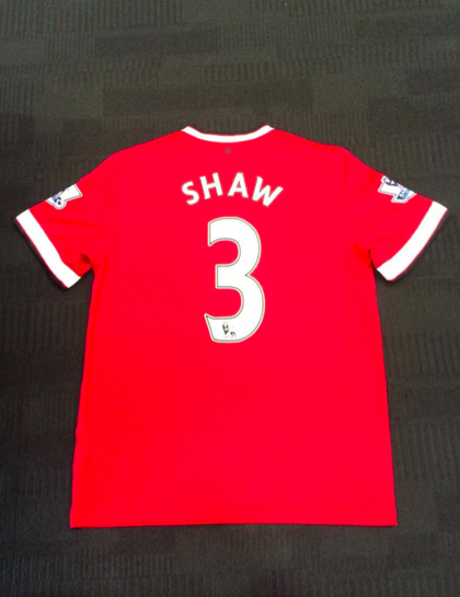 Charitybuzz: Signed Luke Shaw Manchester United Jersey from the 2014-2 ...