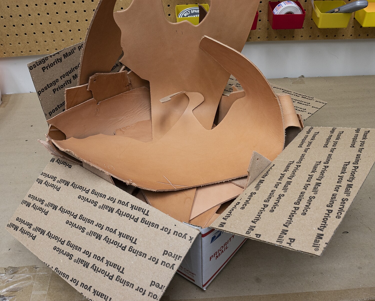 Box of leather scraps - Store - Milt Sparks