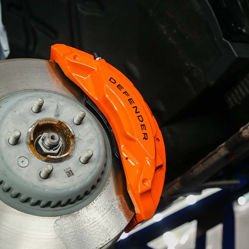 Curved 'DEFENDER' Brake Caliper Stickers for Land Rover Defender 90/110!