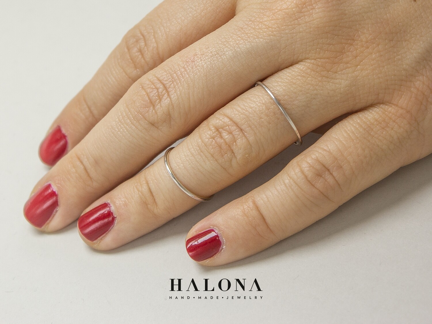 Two handmade thin silver rings.