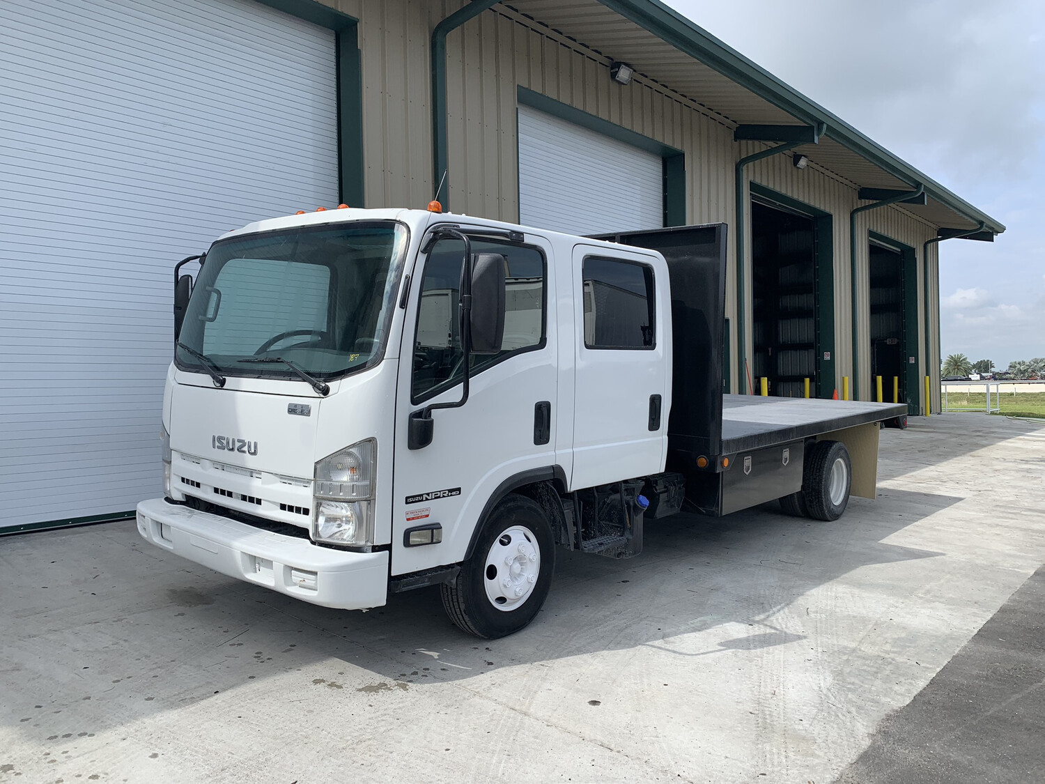 2011 Isuzu NPR HD Crew Cab W/14’ft flatbed
