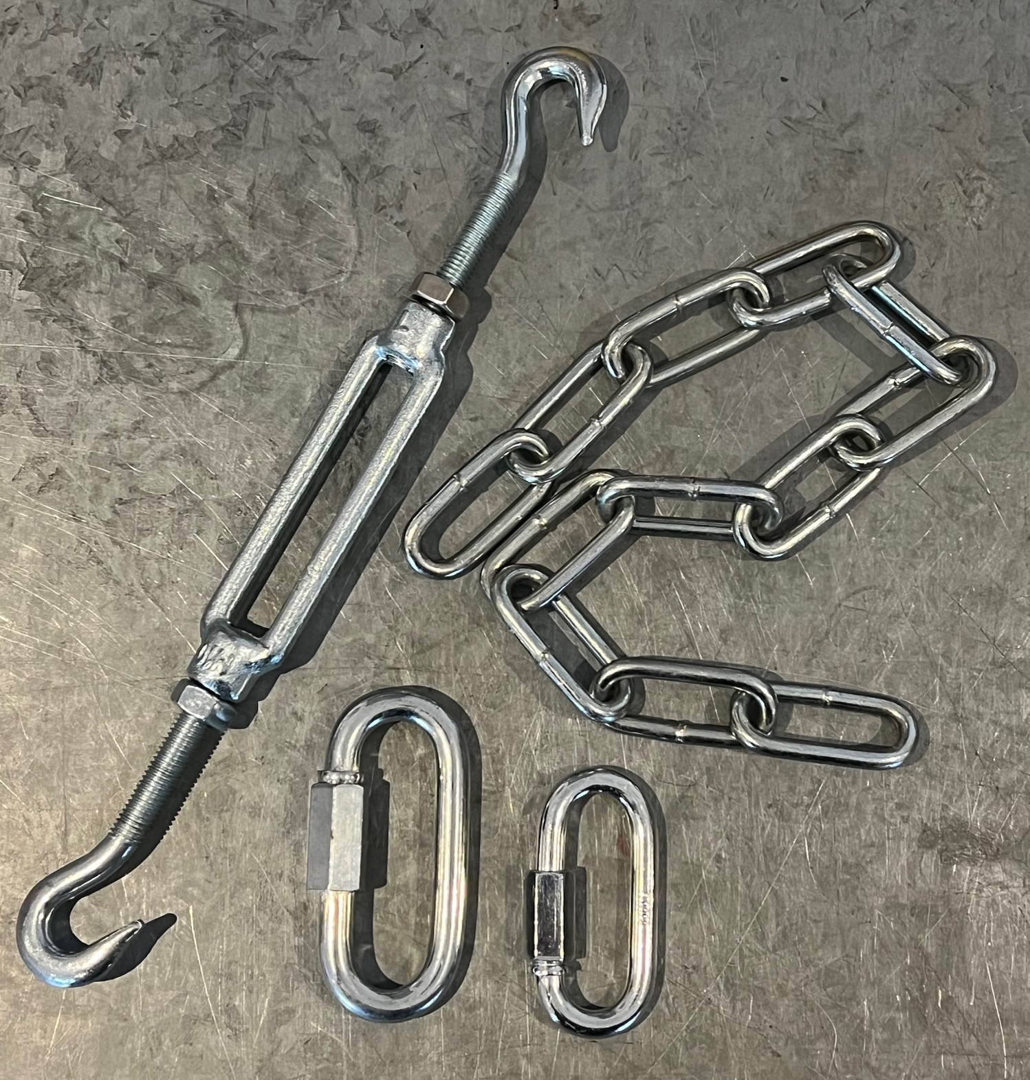 Chain and chain adjusters
