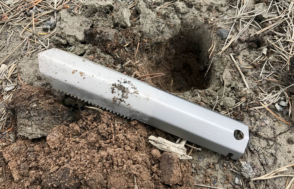 Ultralight Titanium Tool Digs Perfect Poo Holes | GearJunkie