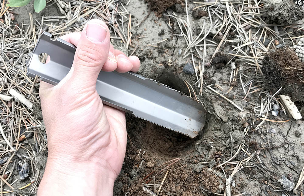 Ultralight Titanium Tool Digs Perfect Poo Holes | GearJunkie