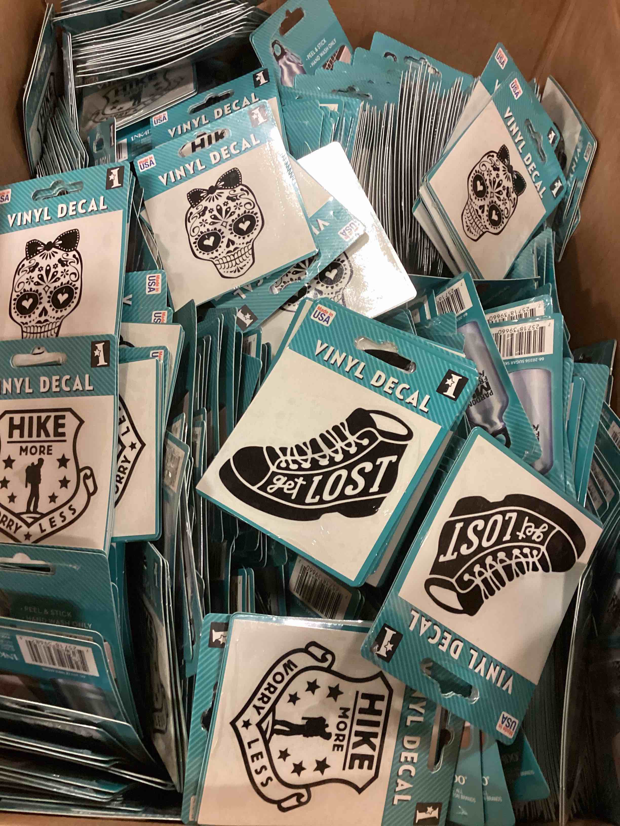 LARGE BOX OF 100’S OF VINYL DECALS WITH DIFFERENT SAYINGS