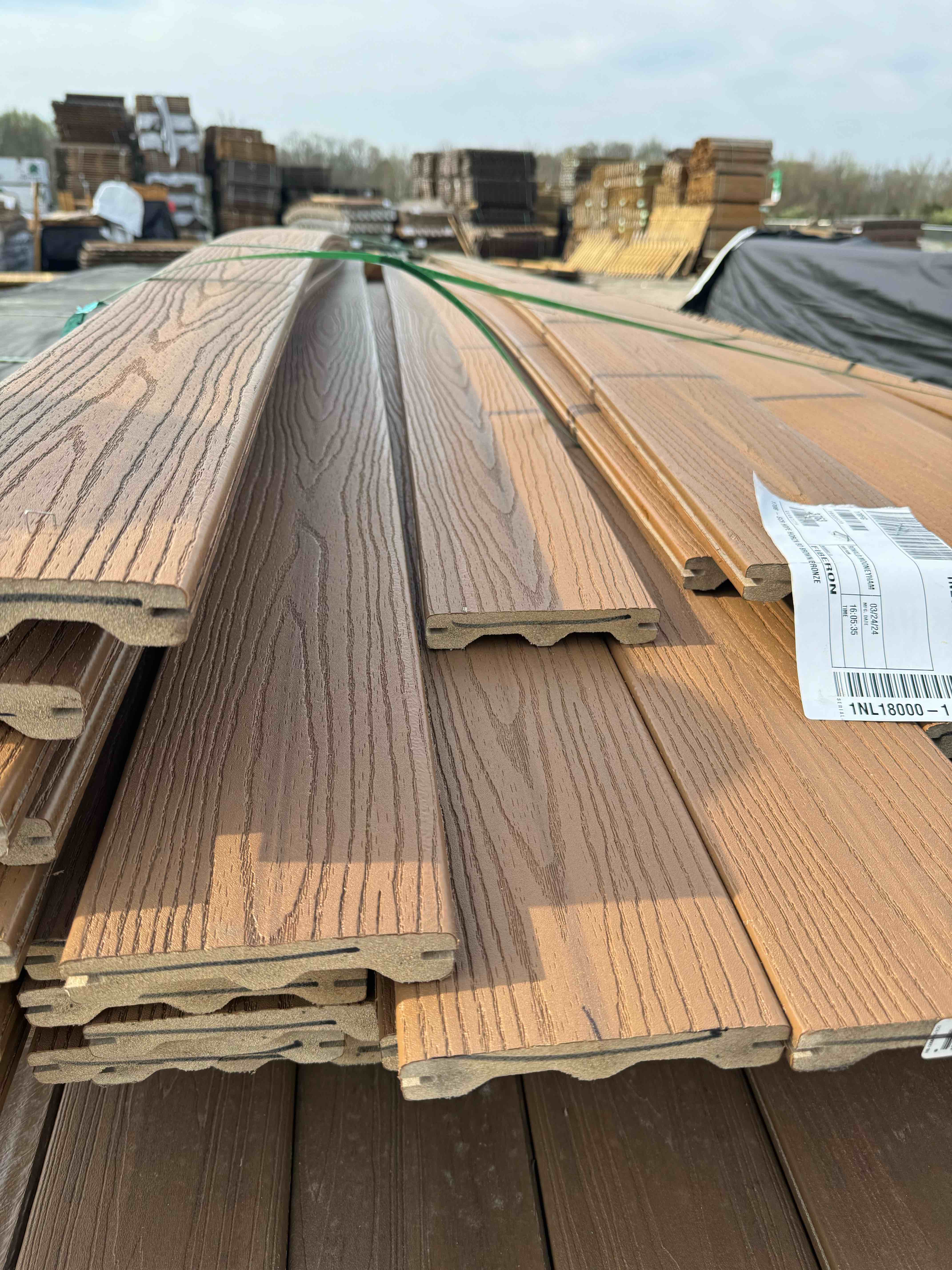 1,120 linear foot 56 pieces of 20’ grooved composite decking in brown ...