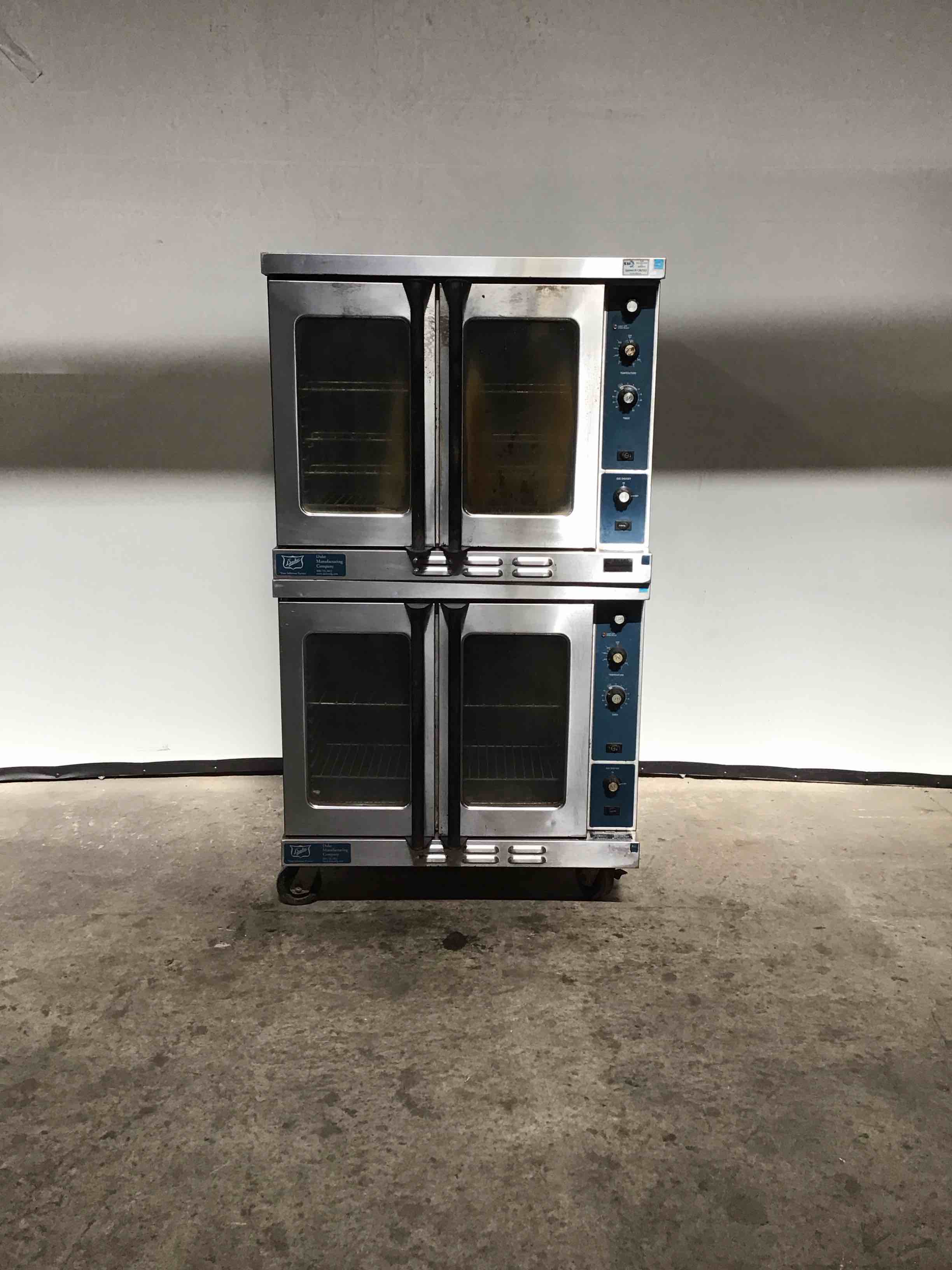 DOUBLE STACK OF DUKE NATURAL GAS FULL SIZE CONVECTION OVENS ON CASTERS