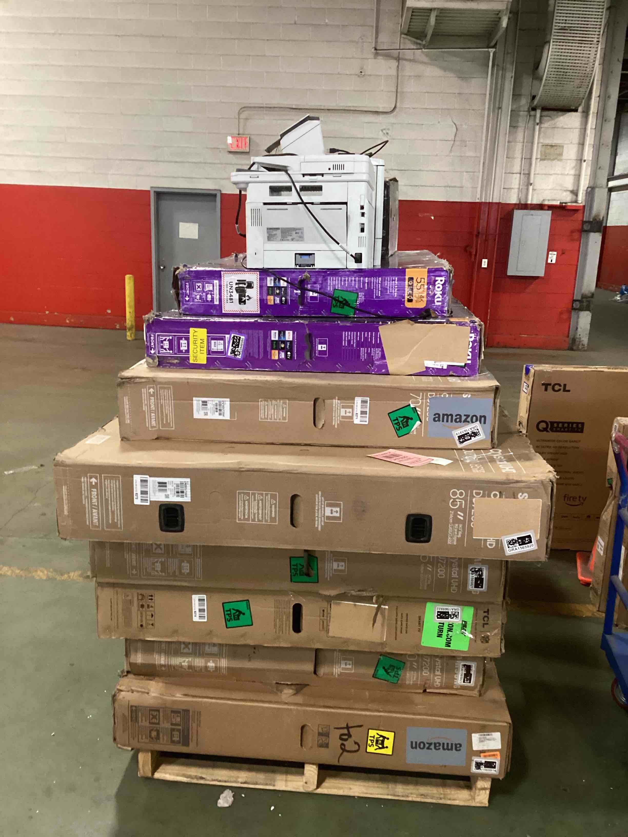 pallet of defective electronics for parts