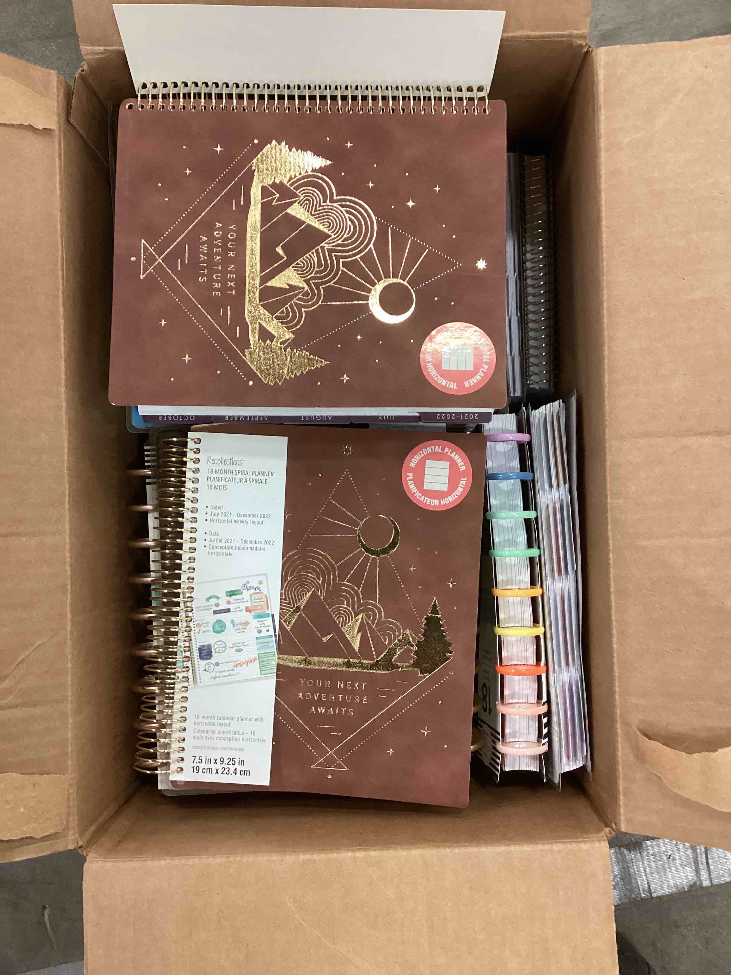box of assorted planners