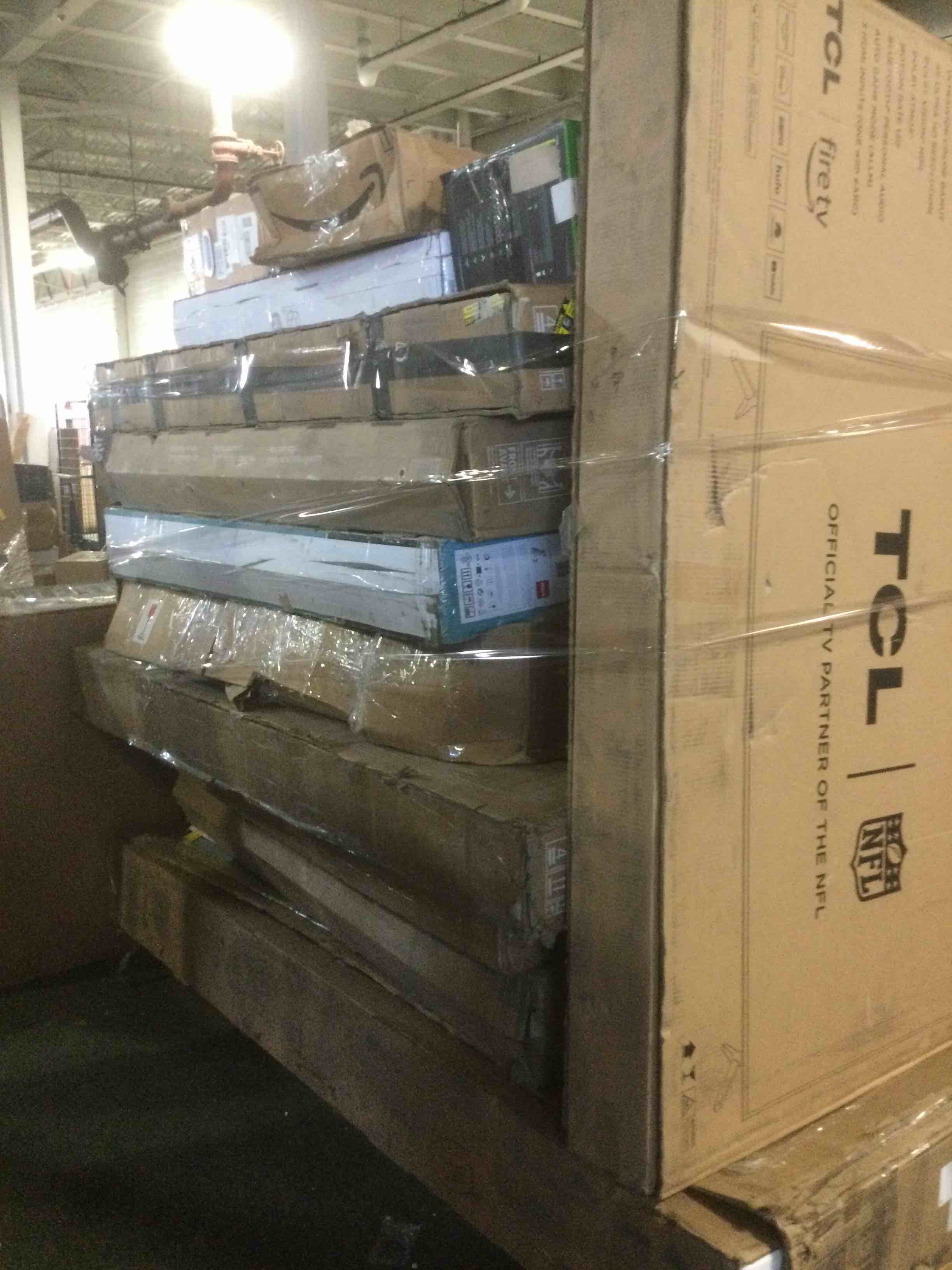 Pallet of defective electronics, various sizes and brands (televisions ...