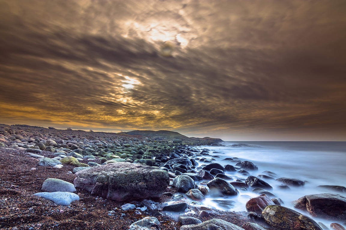 Danni Efraim Photography | Shoreline with wet rocks and dramatic sky