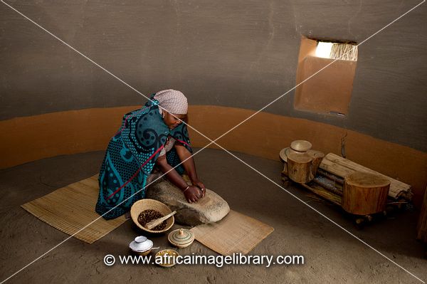 Photos and pictures of: Sotho woman grinding maize, Basotho Cultural ...