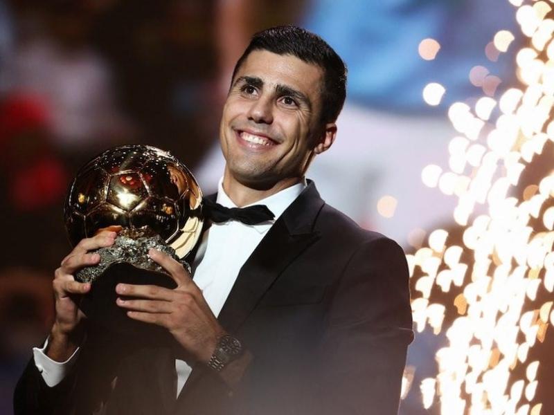 NRIPage | Articles | Rodri Wins Ballon d'Or as Real Madrid Boycotts Ceremony | Get Indian Desi ...