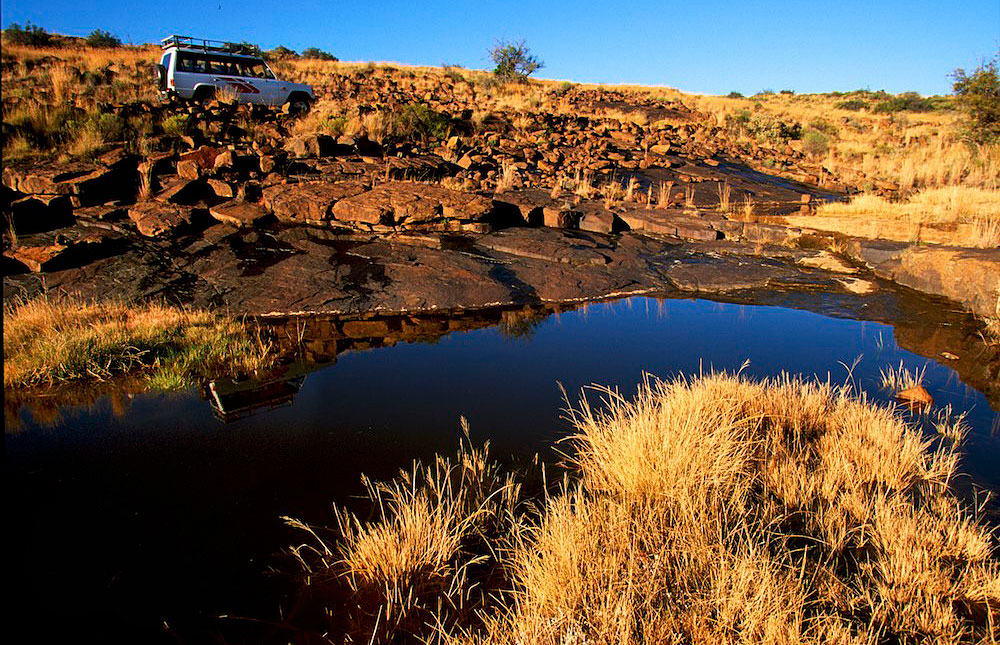 Vehicle in dry scenery in Karoo National Park, South Africa