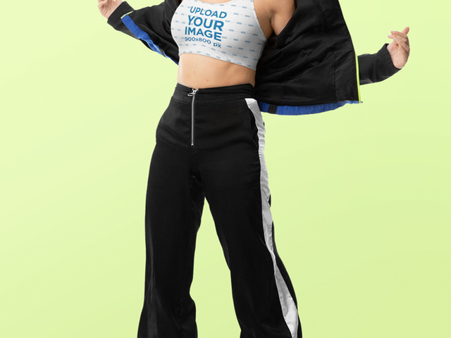 Placeit - Sports Bra Mockup of a Woman Jumping at a Studio