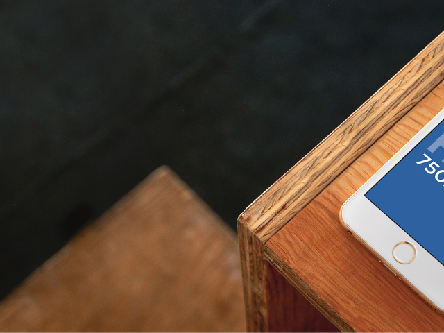 Placeit - Wide Mockup of an iPhone 6 on Top of a Wooden Desk