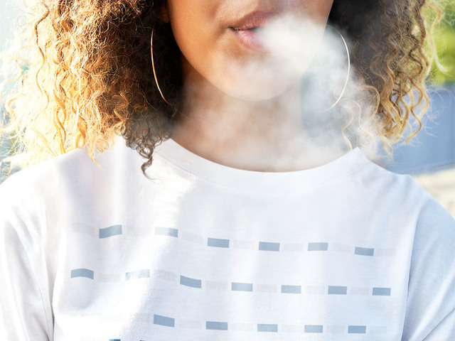 Placeit - Long Sleeve Tee Mockup of a Curly-Haired Woman Smoking