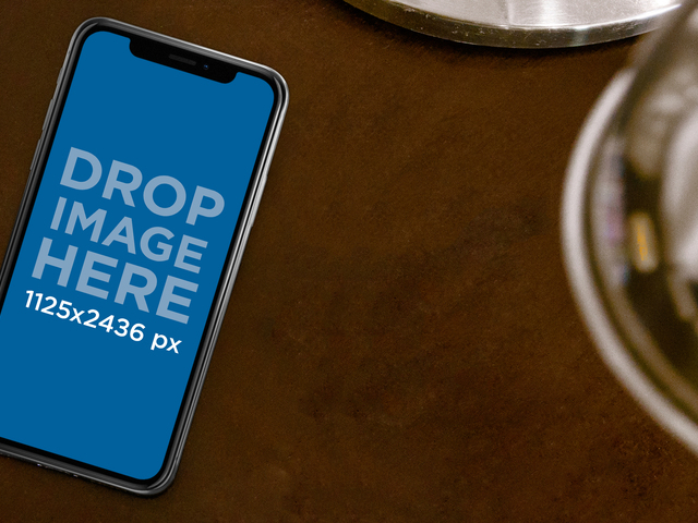 Placeit - Mockup of an iPhone 11 Pro Lying on a Vintage Office Desk