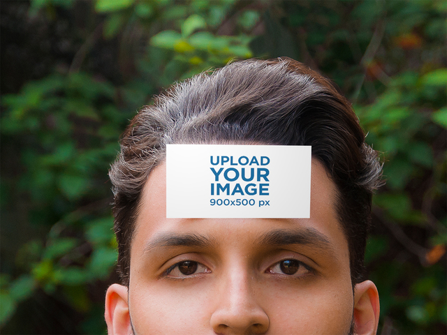 Placeit - Fun Business Card Mockup - Man Holding Business Card on Forehead