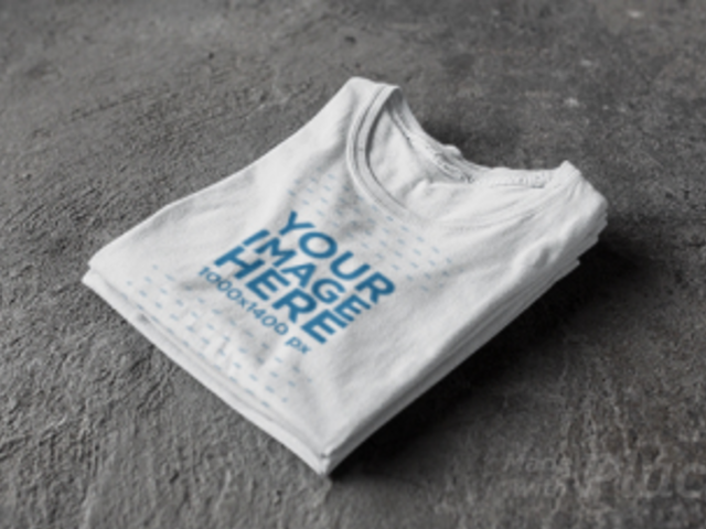 Placeit - Folded Round Neck T-Shirts Stacking on a Concrete Floor in ...