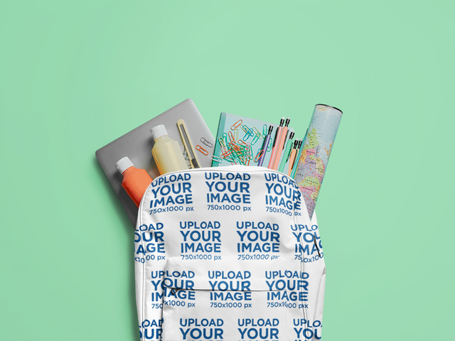 Placeit - Mockup of a Backpack With School Supplies Inside