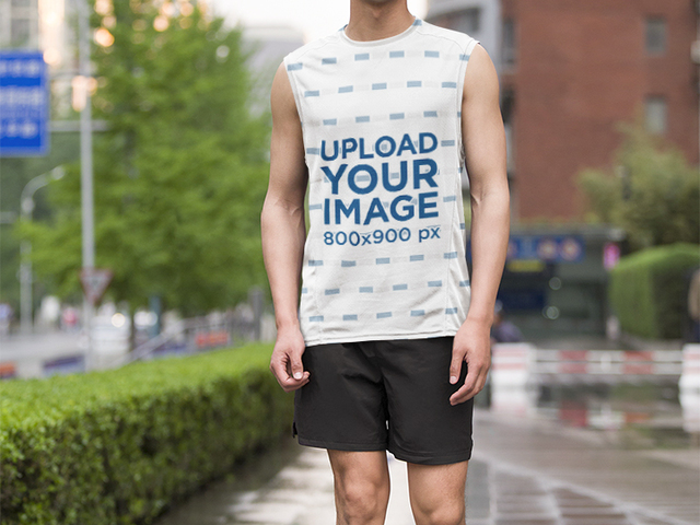 Placeit - Tank Top Mockup Featuring a Happy Man Taking a Walk in the Street