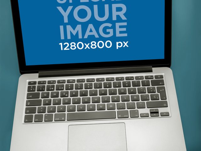 Placeit - Overhead View Mockup of a MacBook Pro on a Solid Surface