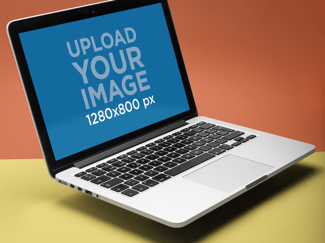 Placeit - Mockup of a MacBook Floating on a Surface with Two Colors