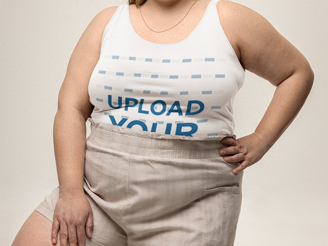 Placeit - Tank Top Mockup Featuring a Smiling Woman Sitting on a Stool ...
