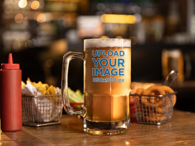 Placeit - Mockup of a Beer Glass on a Table Filled with Fried Snacks