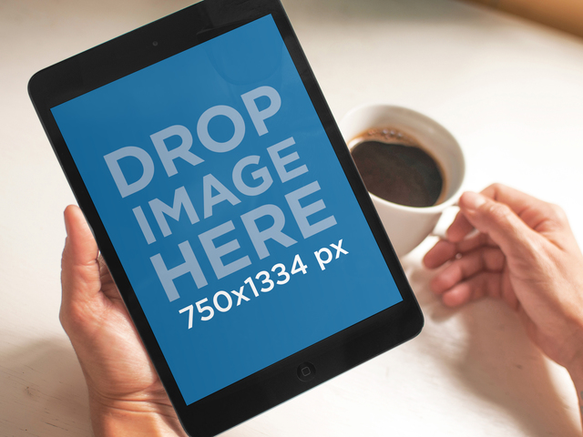 Placeit - Mockup of a Woman Holding a Mini iPad