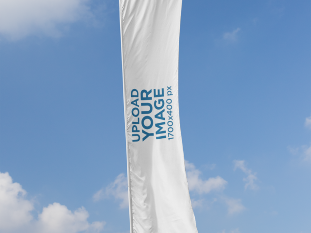 Placeit - Flag Banner Mockup Against a Blue Sky Backdrop
