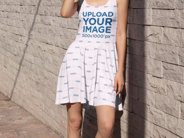 Placeit - Skater Dress Mockup of a Woman Leaning on a Brick Wall
