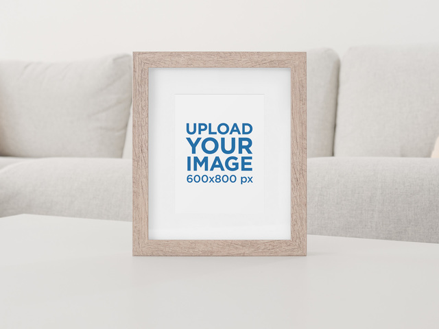 Placeit - Art Print Mockup Featuring a Wooden Picture Frame at a Living ...