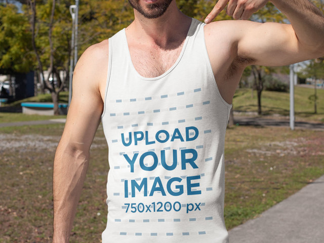 Placeit - Mockup of a Fitness Man Pointing at His Muscle Shirt