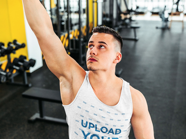 Placeit - Tank Top Mockup of a Muscular Man at the Gym