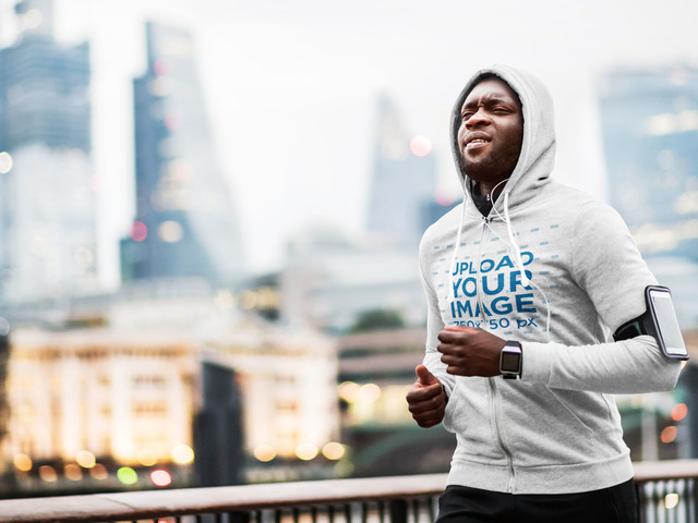 Placeit - Mockup of a Running Man Against a City Landscape