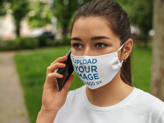 Placeit - Face Mask Mockup Featuring a Woman on the Phone