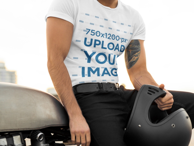 Placeit - T-Shirt Mockup of a Muscular Man Sitting on a Motorcycle