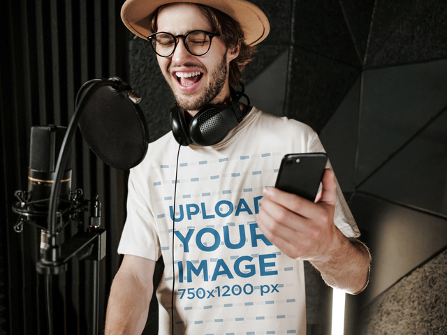 Placeit - Mockup of a Male Singer Wearing a T-Shirt in a Studio