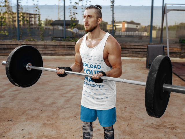 Placeit - Tank Top Mockup of a Muscular Man Lifting Weights at a Park