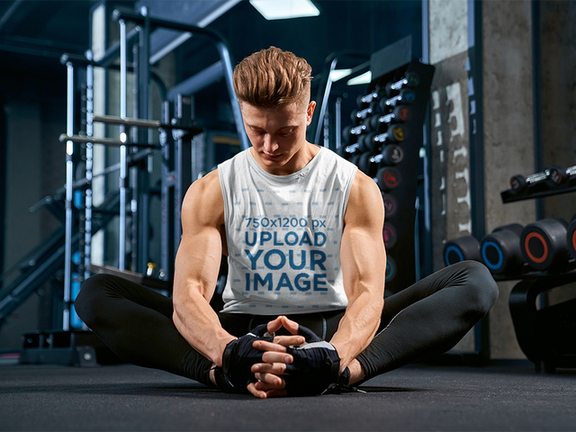 Placeit - Sleeveless Shirt Mockup Featuring a Muscular Man at the Gym